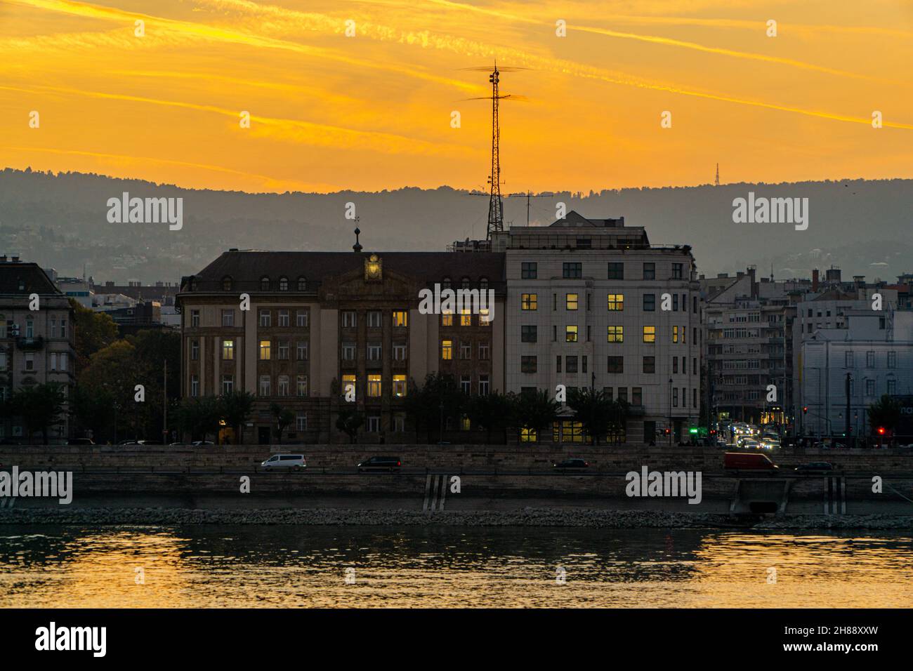 A beautiful view of a lake and buildings at sunset Stock Photo - Alamy