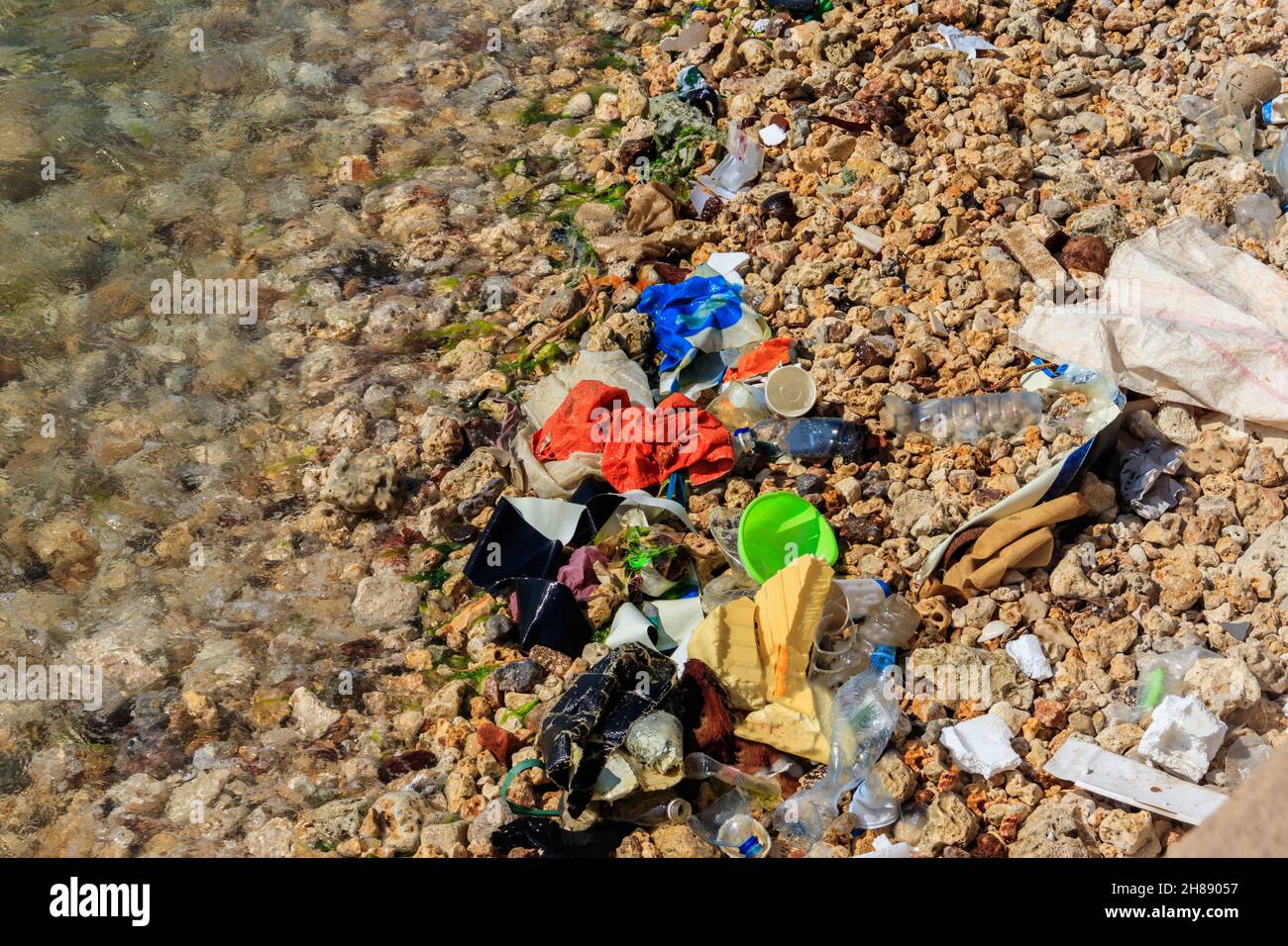Garbage on a bank of ocean. Pollution of sea, ocean water with waste ...
