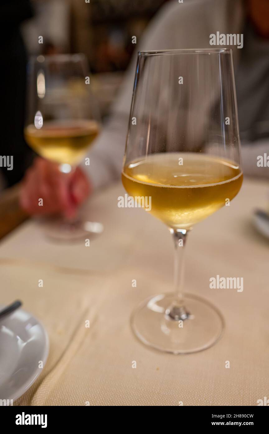 Dinner with sweet cold muscat white desert wine in traditional Italian ...