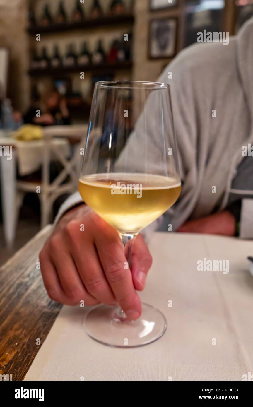 Dinner with sweet cold muscat white desert wine in traditional Italian ...