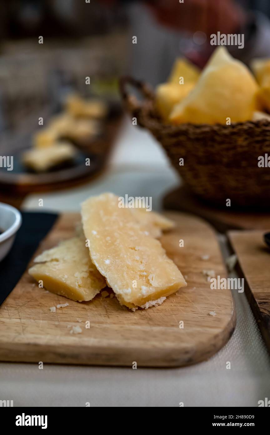 Tasting of different matured and very old parmesan Italian Parmigiano ...