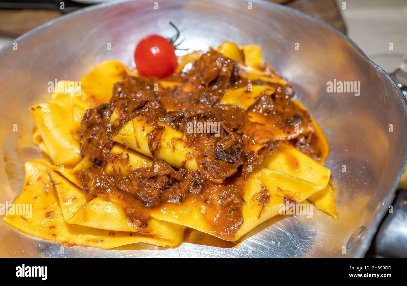 Italian pasta food, homemade pappardelle with wild boar ragu close up ...