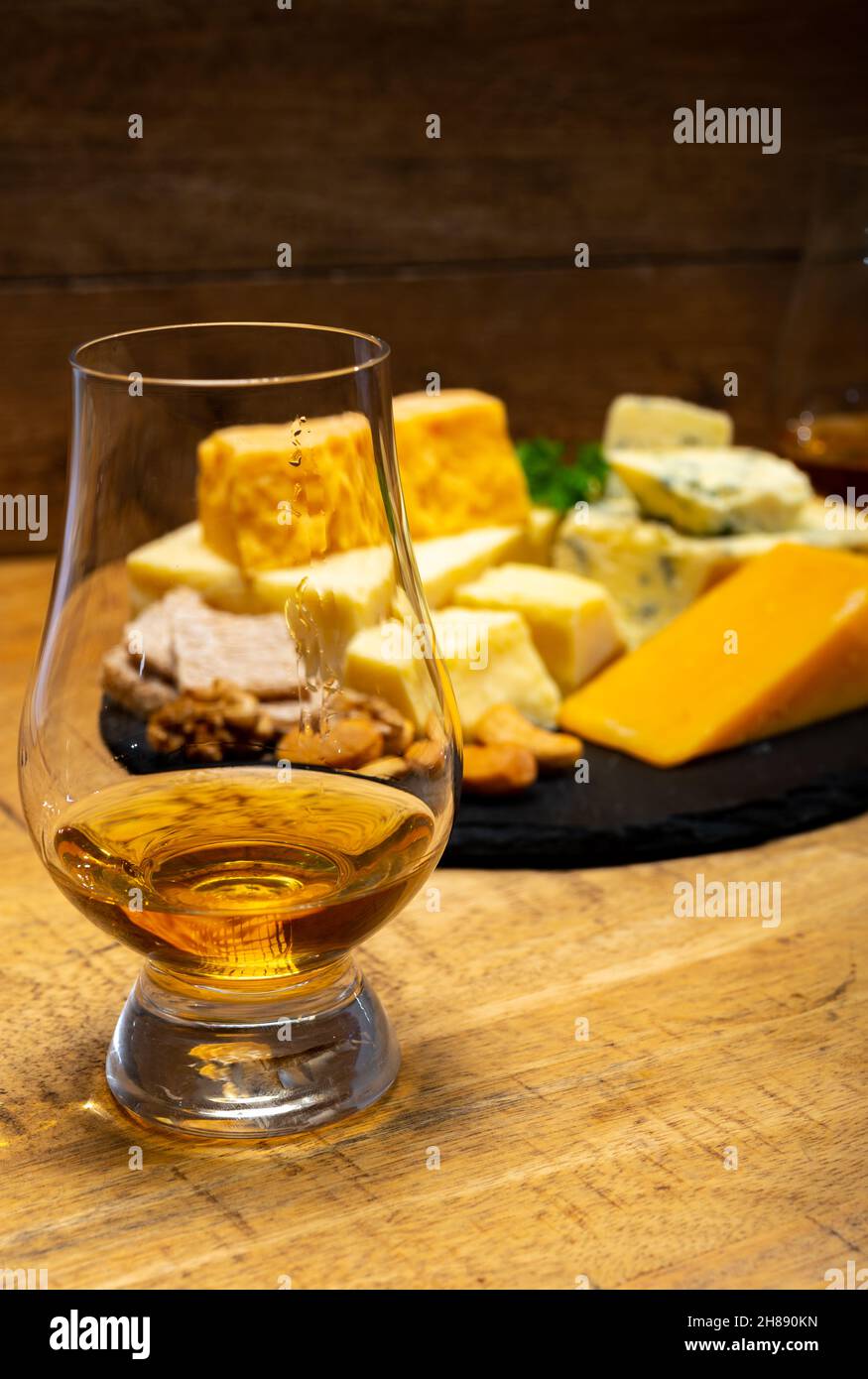 British drinks and food pairing, glasses of Scotch whisky and cheeses ...