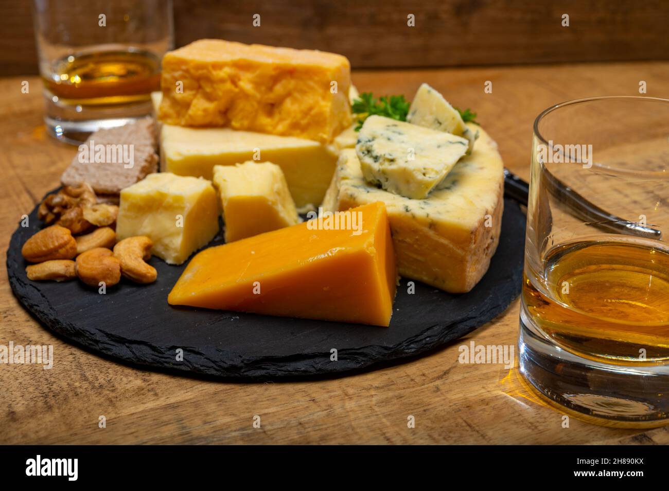 British drinks and food pairing, glasses of Scotch whisky and cheeses ...