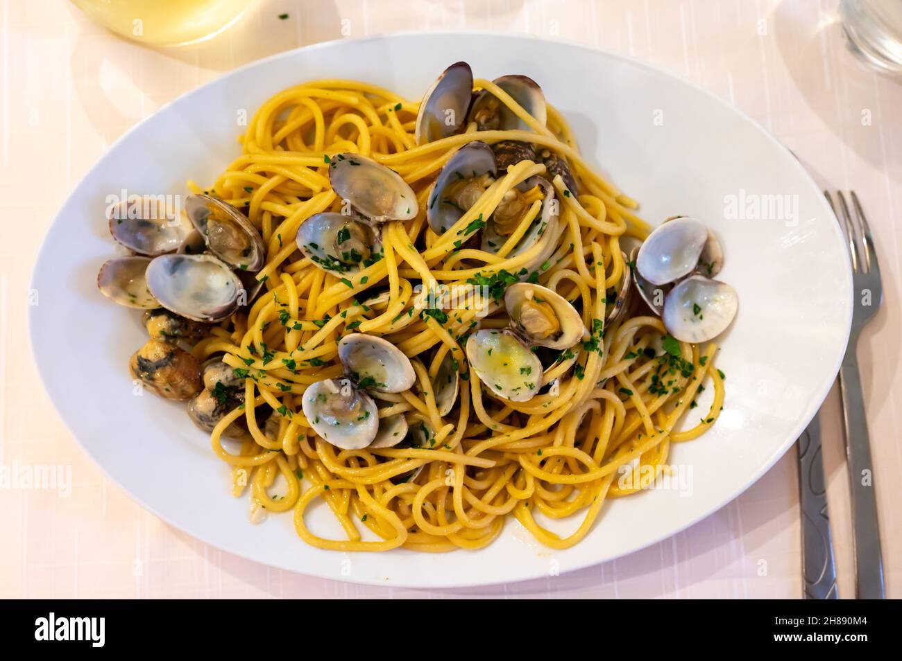 Italian sea food dinner first course pasta with clams alle vongole ...