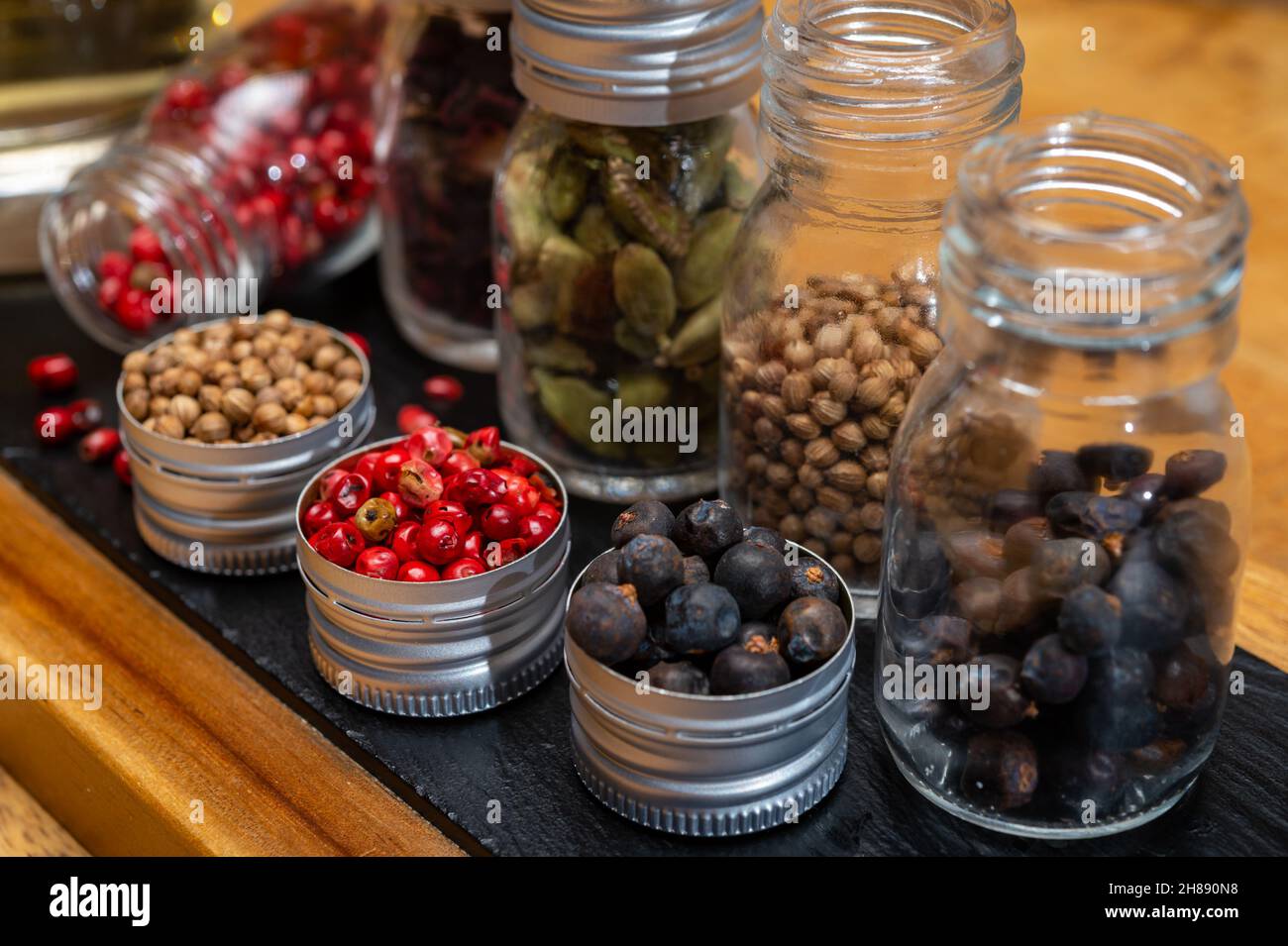 Professional set of gin spices in small bottles, pink pepper, hibiscus ...