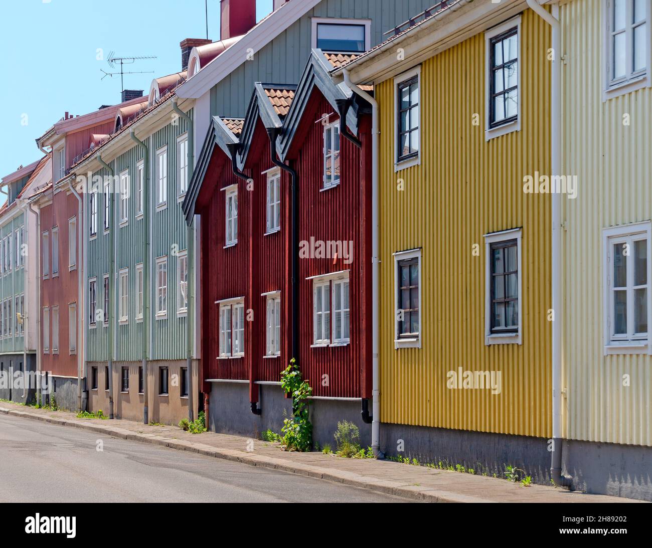 colorful wooden facades of houses in a street in the little town of ...