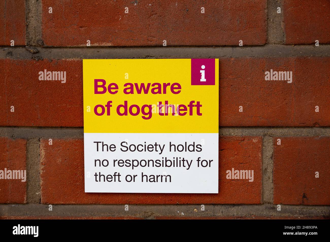 'Be aware of dog theft' sign outside of a supermarket informing the ...
