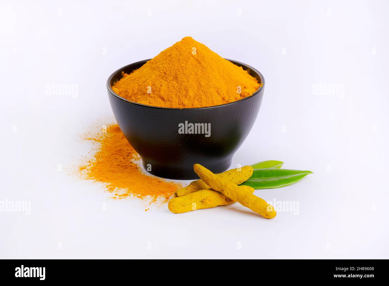 Turmeric (curcumin) powder, Turmeric powder in bowl next to turmeric ...