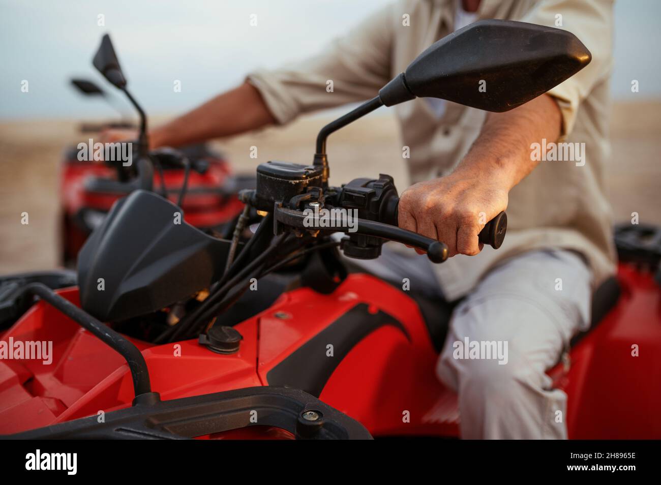 Atv racer in desert, closeup front view on hands Stock Photo - Alamy