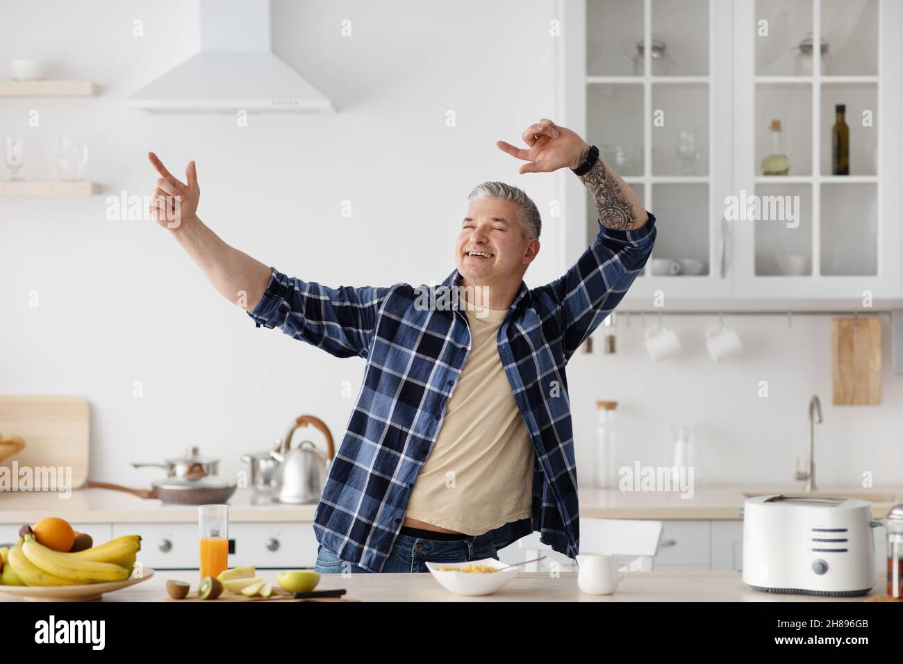 Dancing man alone in kitchen hi-res stock photography and images - Alamy