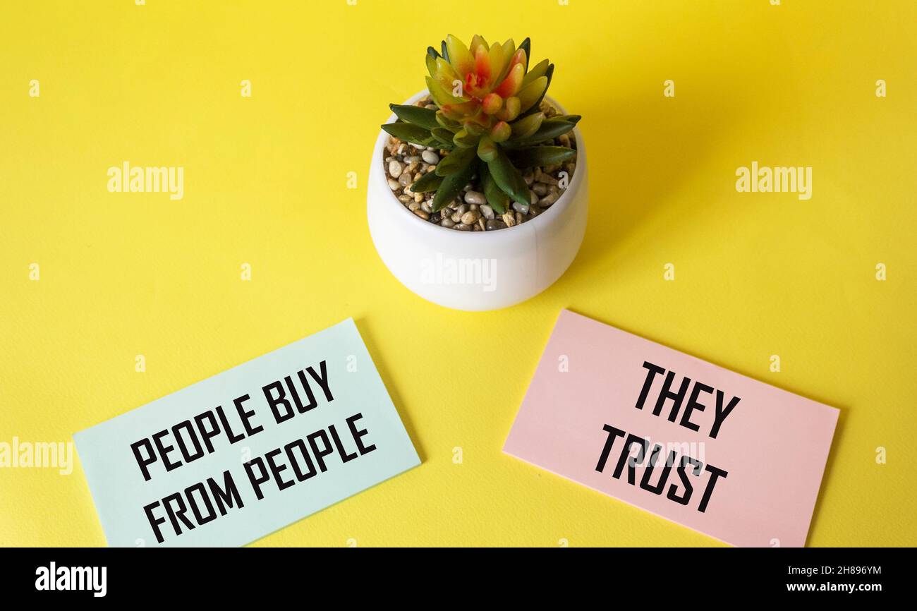 People buy from people they trust, it says on stickers and a yellow ...