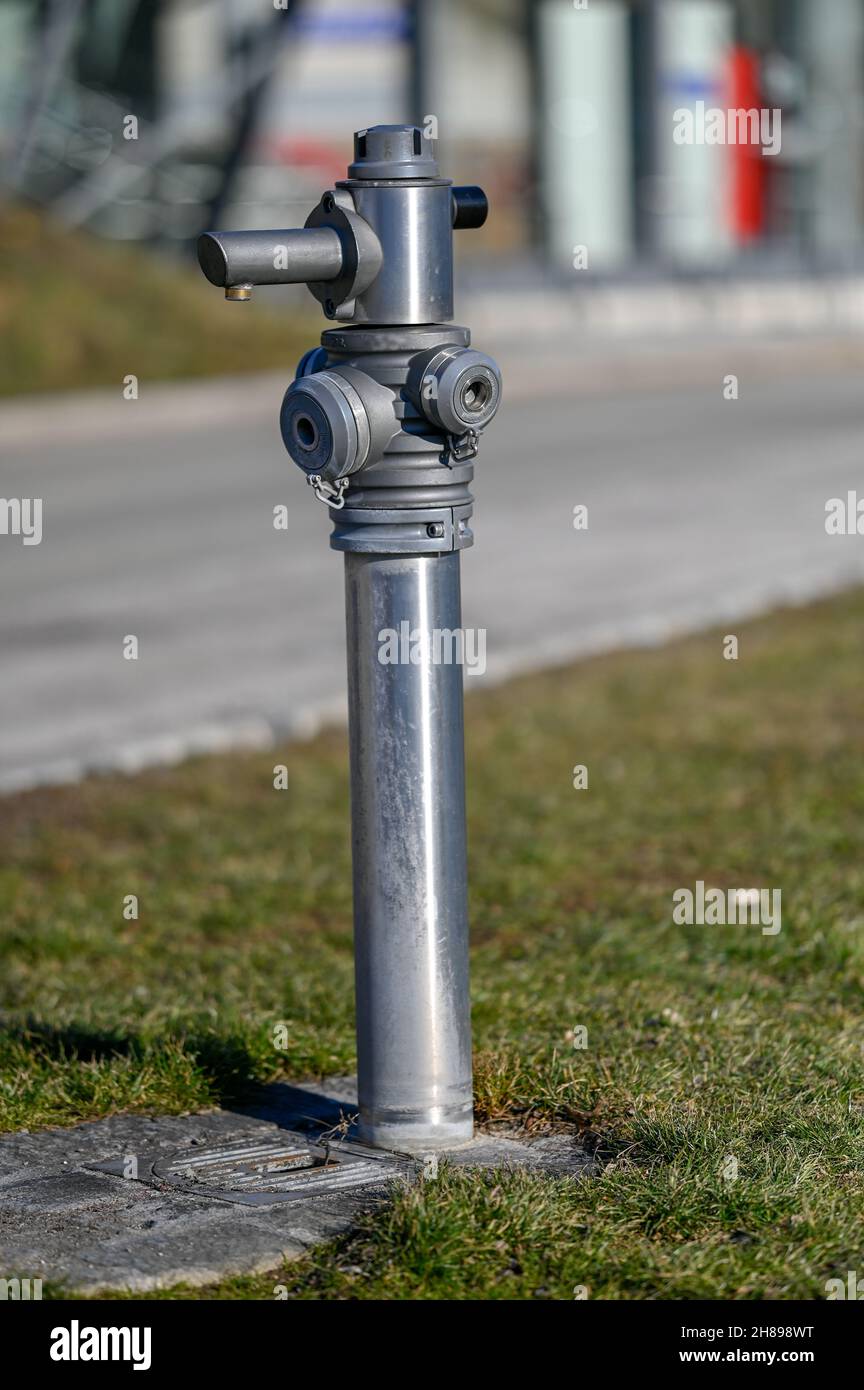 A freestanding fire hydrant in a parking lot Stock Photo - Alamy
