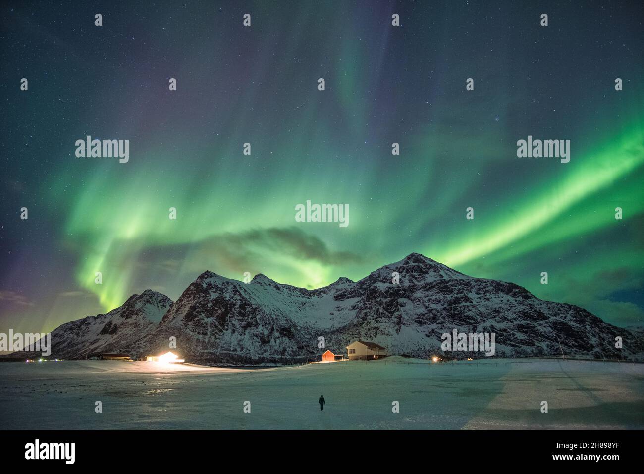 Aurora borealis, Northern lights over snow mountain range in skagsanden ...