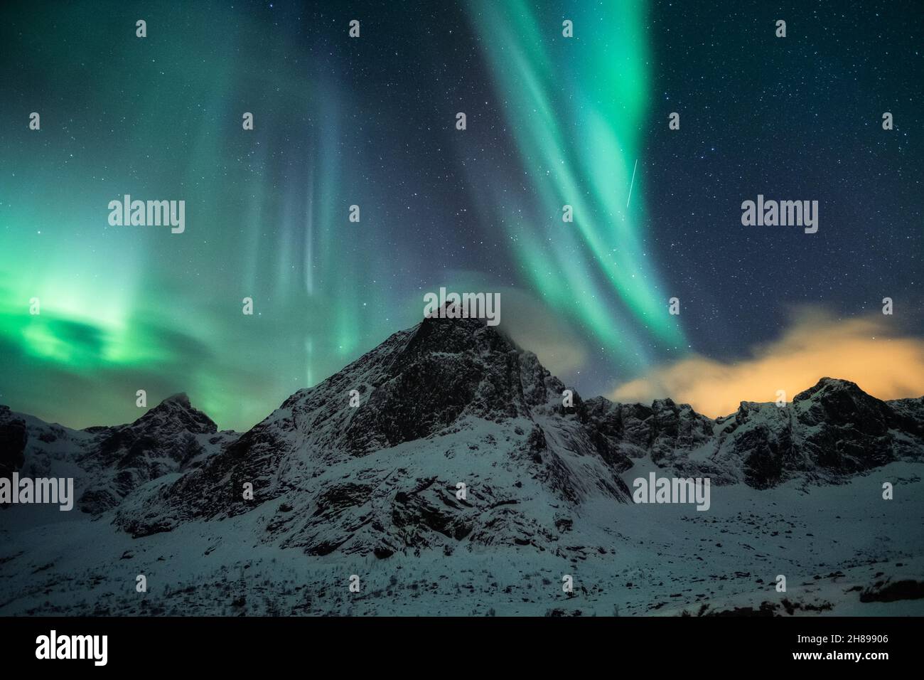 Aurora borealis, Northern lights with starry over snow mountain peak on ...