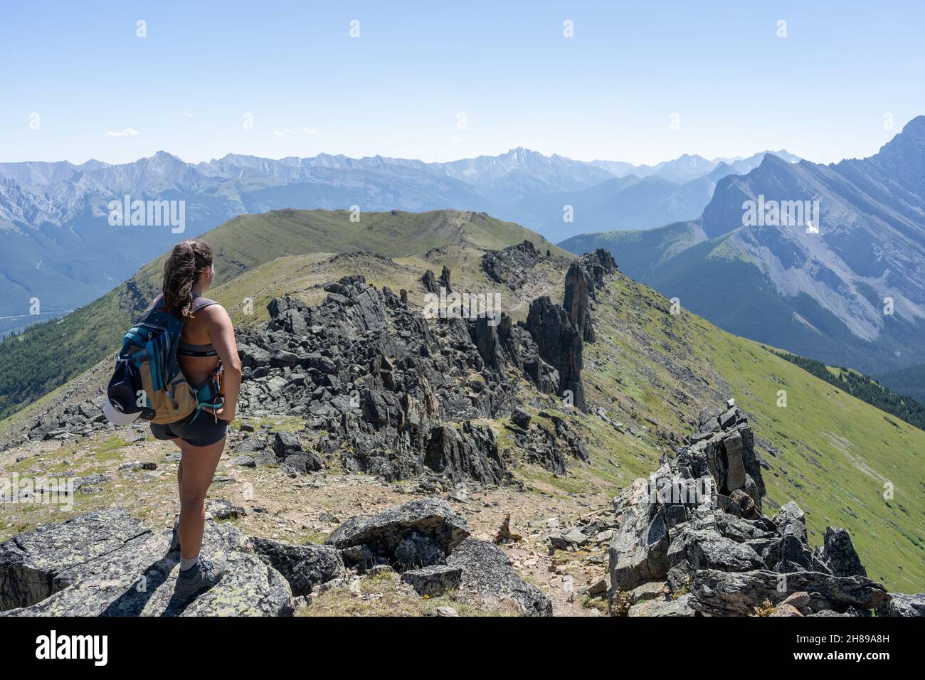 Female hiker enjoying view on rocky alpine landscape, Canadian Rockies ...