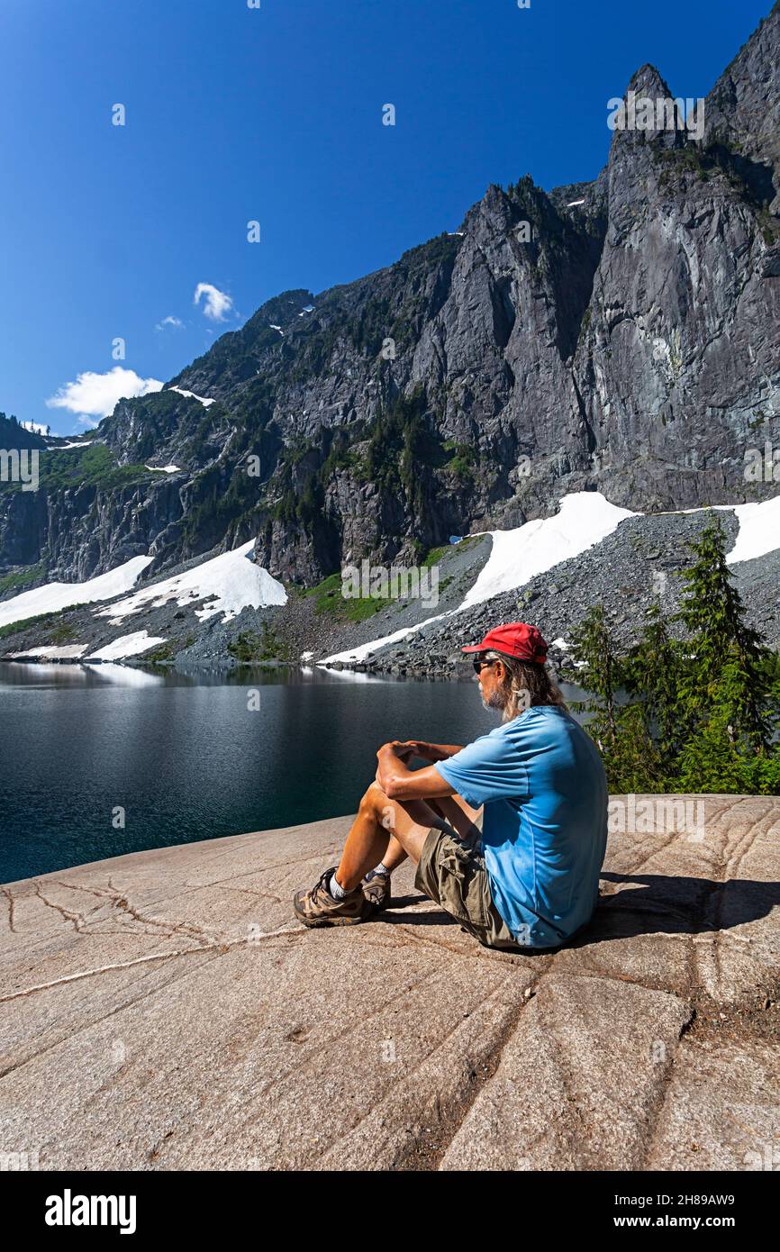WA19833-00...WASHINGTON - Hiker enjoy the view of Lake Serene and Mount Index in the Mount Baker ...