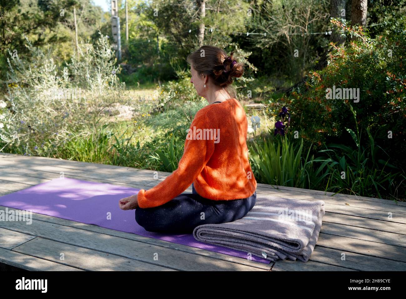 Woman yoga practitioner stretching hi-res stock photography and images ...