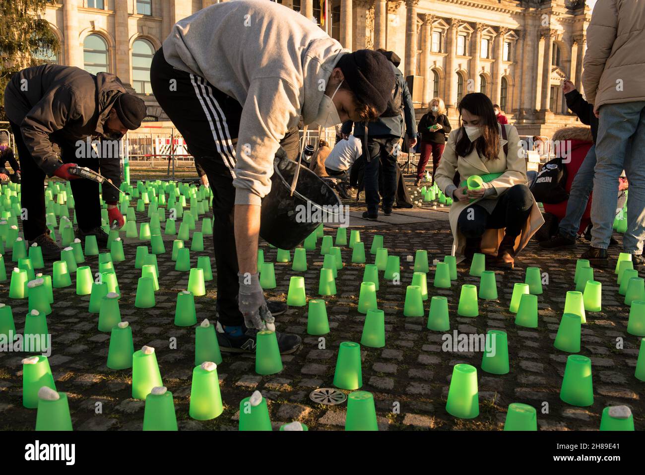 Berlin, Germany. 28th Nov, 2021. Green lights in front of the Reichstag ...