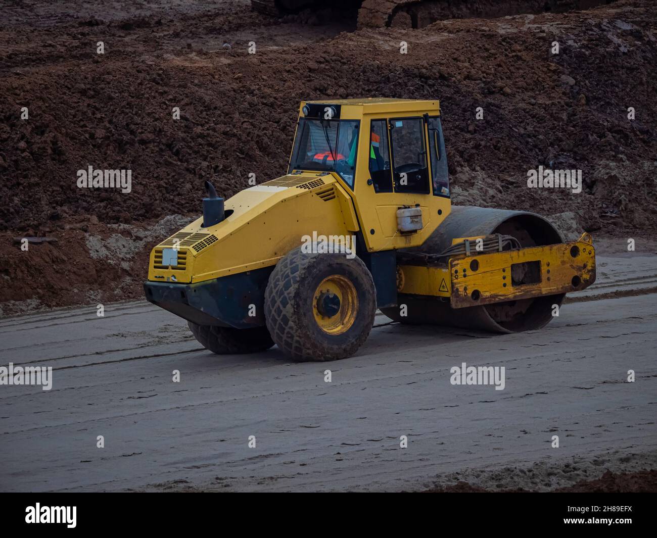 Road roller close up. Highway construction site details. Roller rolling ...