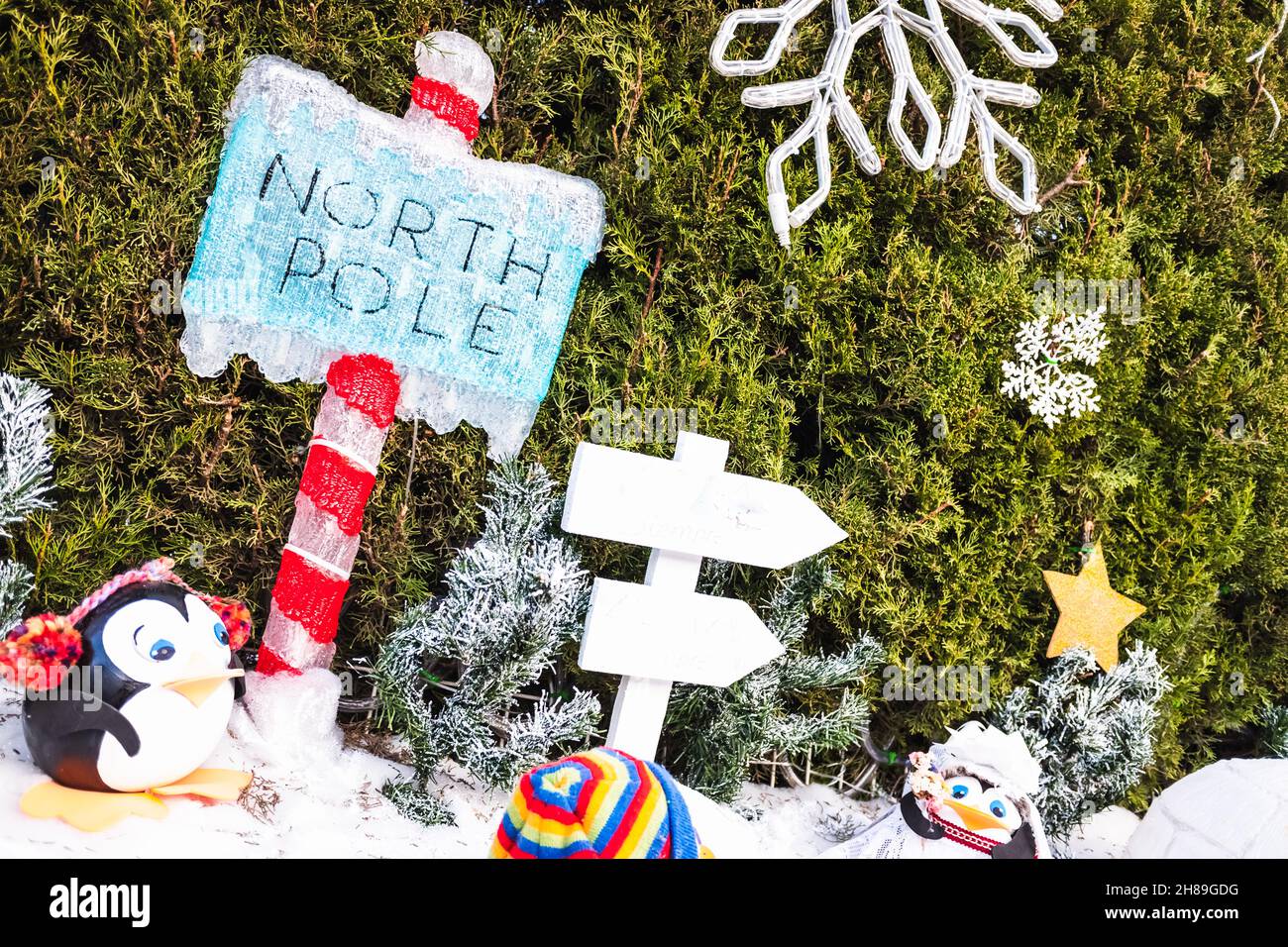 The North Pole is where Santa Claus lives, a sign indicating direction ...