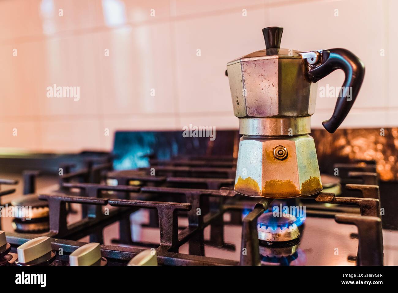 Traditional Italian aluminum coffee pot, on fire in a kitchen Stock ...