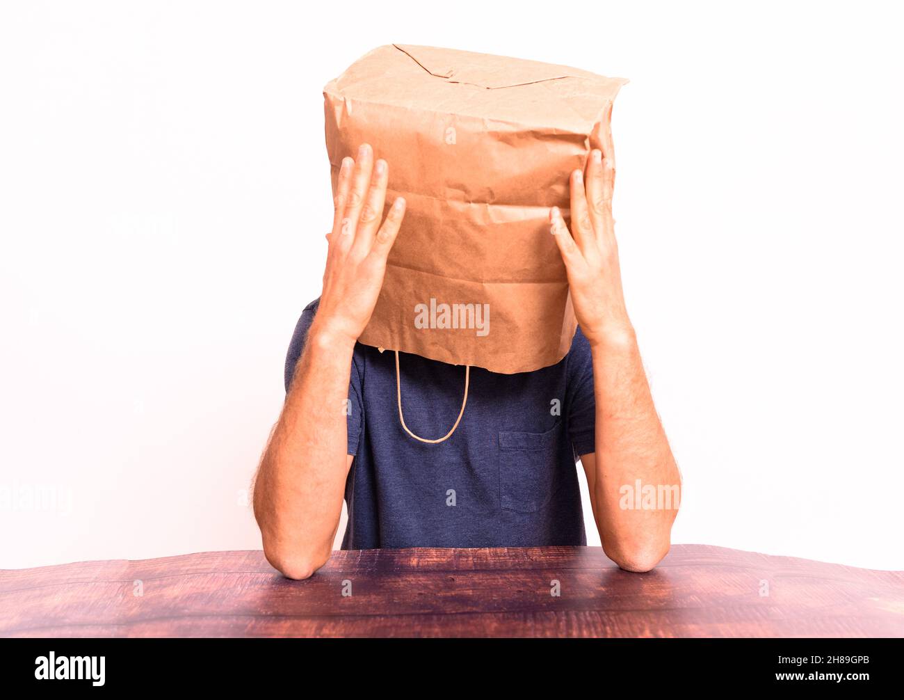 Anonymous man with a covered head in a losing and sad attitude, with ...
