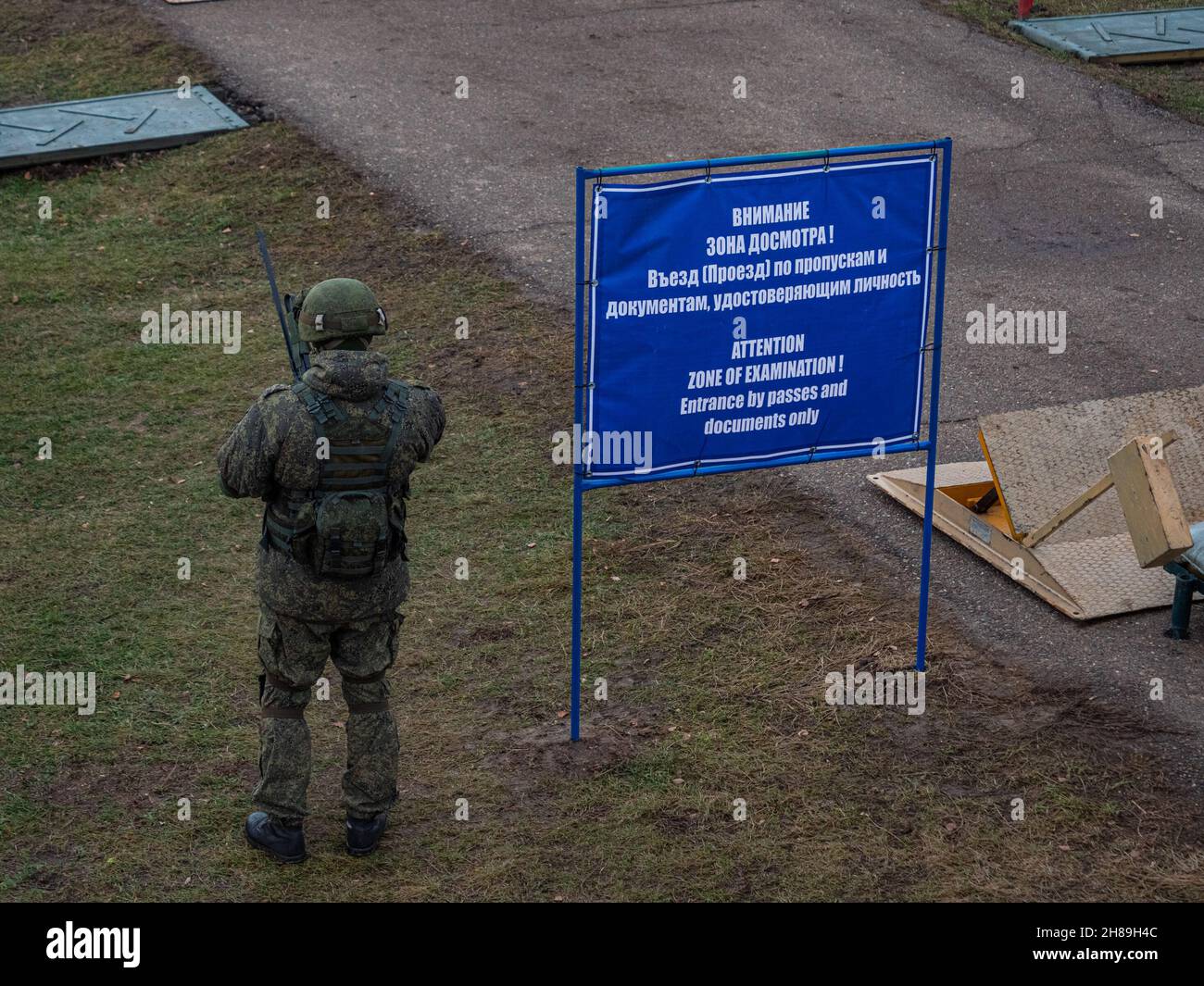 A soldier at a checkpoint. Entering the inspection area on the ...