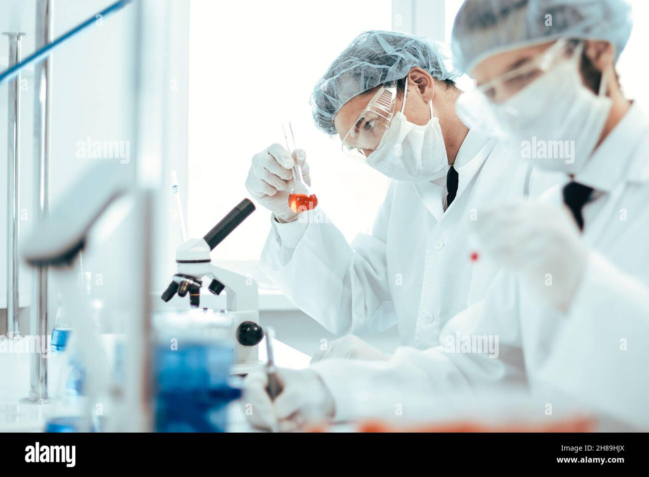 close up. group of scientists conduct research in the laboratory Stock ...