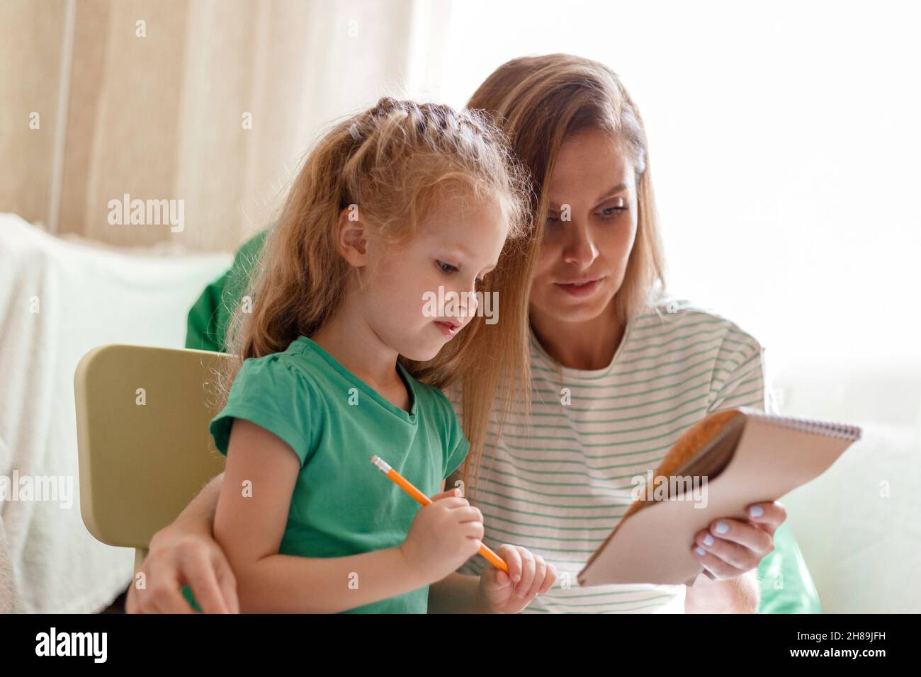 Caucasian blonde smart child kid 5 years do homework Learn to write ...