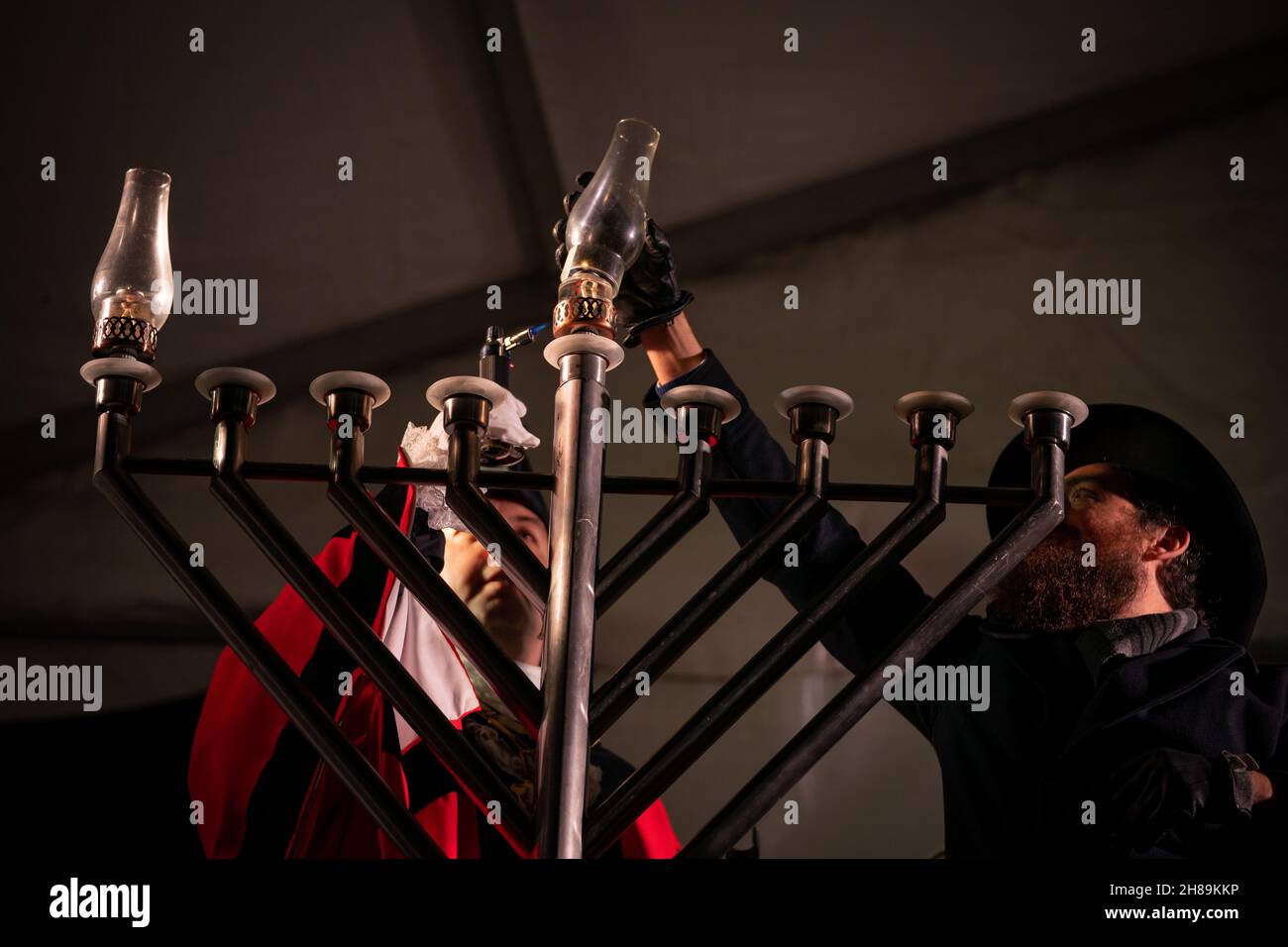 Rabbi Mendy Korer and Mayor of Islington Troy Gallagher light the ...