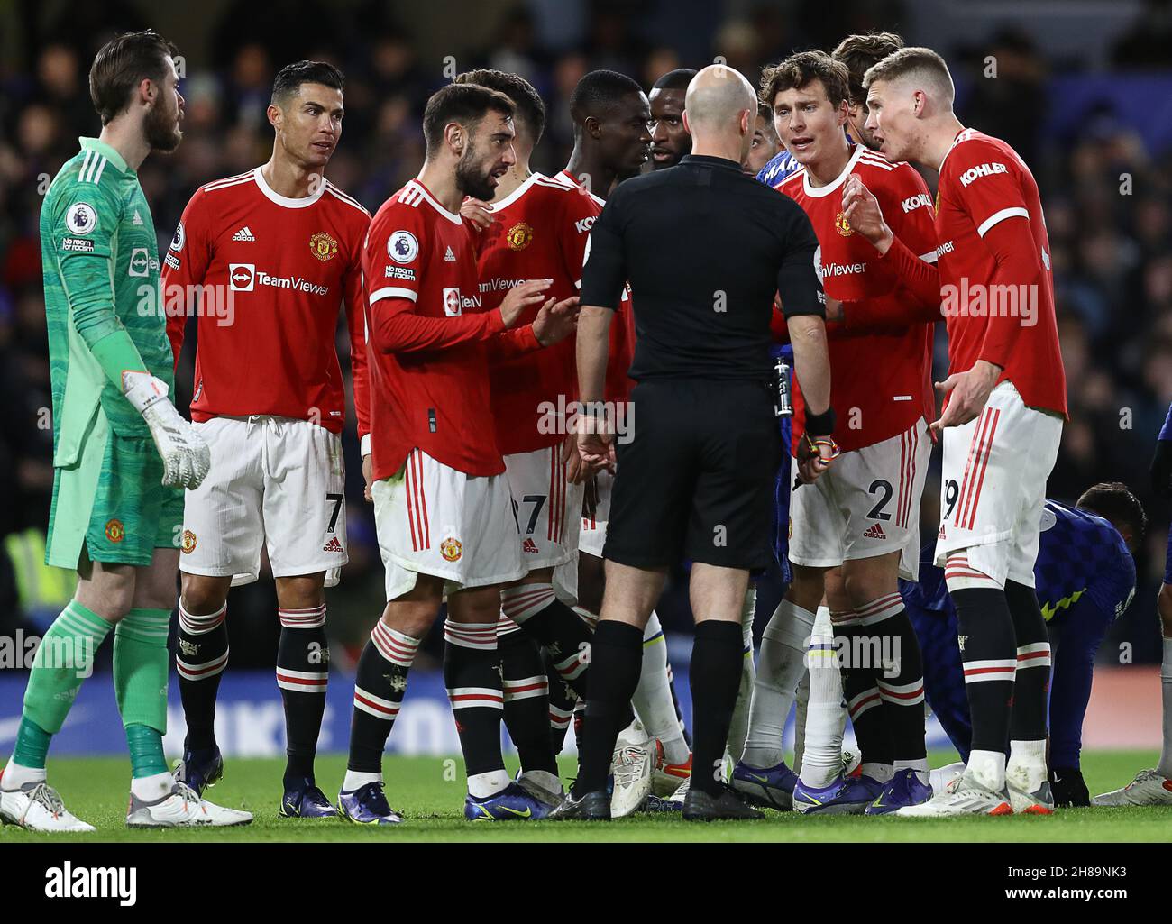 London, England, 28th November 2021. Manchester United players surround ...