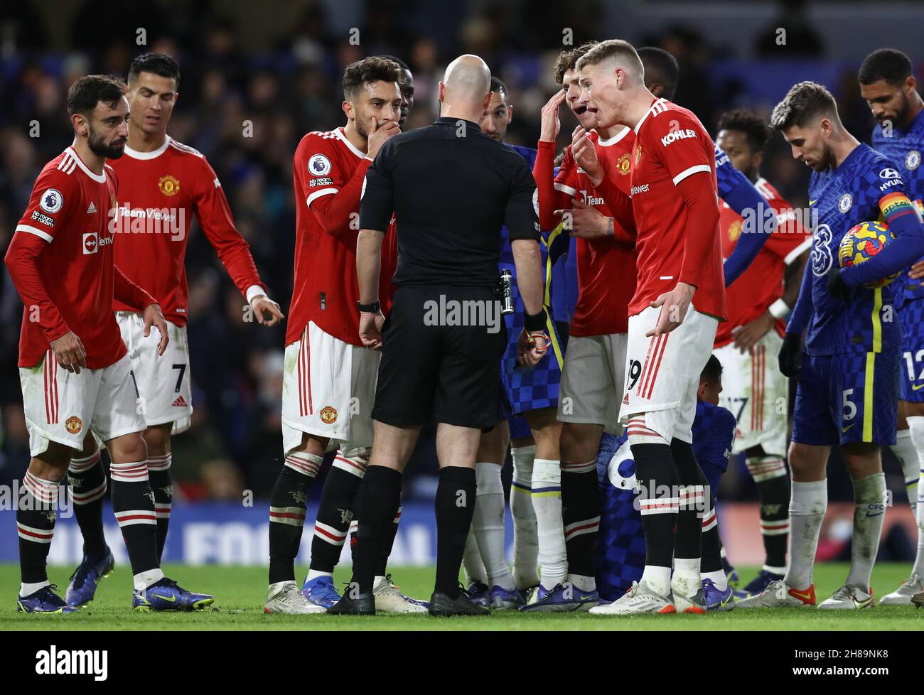 London, England, 28th November 2021. Manchester United players surround ...