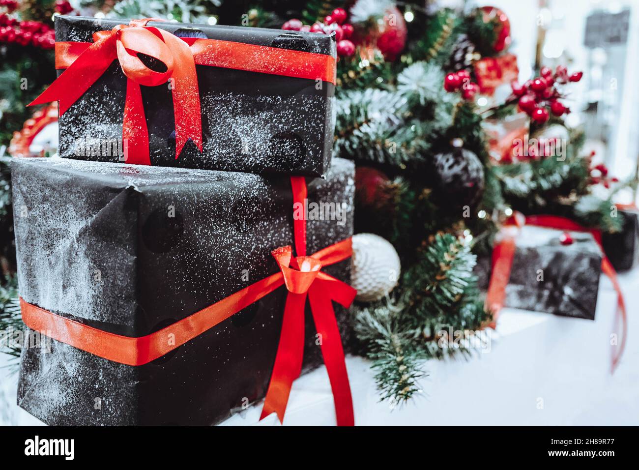 Black boxes red bow hi-res stock photography and images - Alamy
