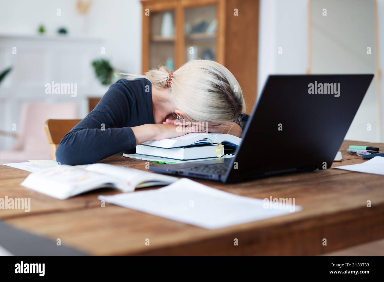 Girl resting head on table hi-res stock photography and images - Alamy