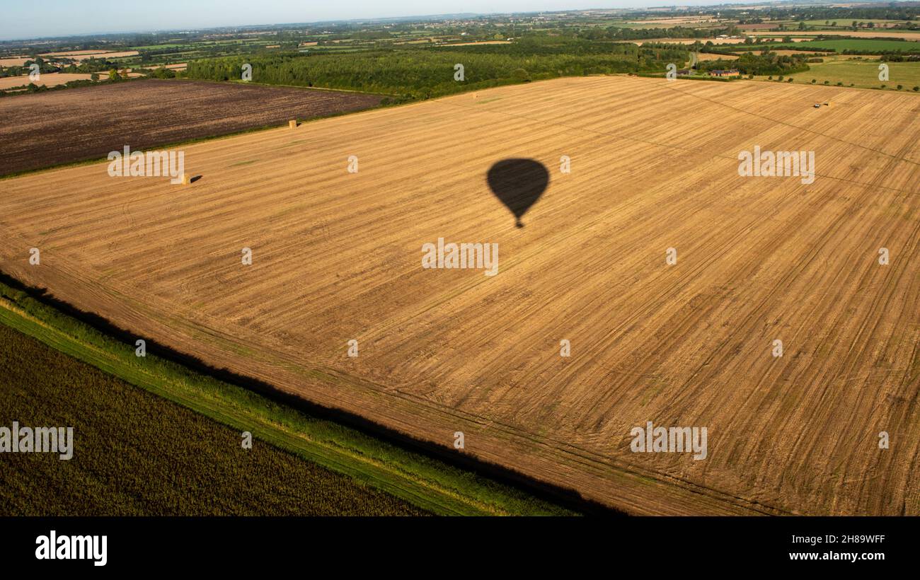 View from above looking down at the shadow of the Hot Air balloon cast ...