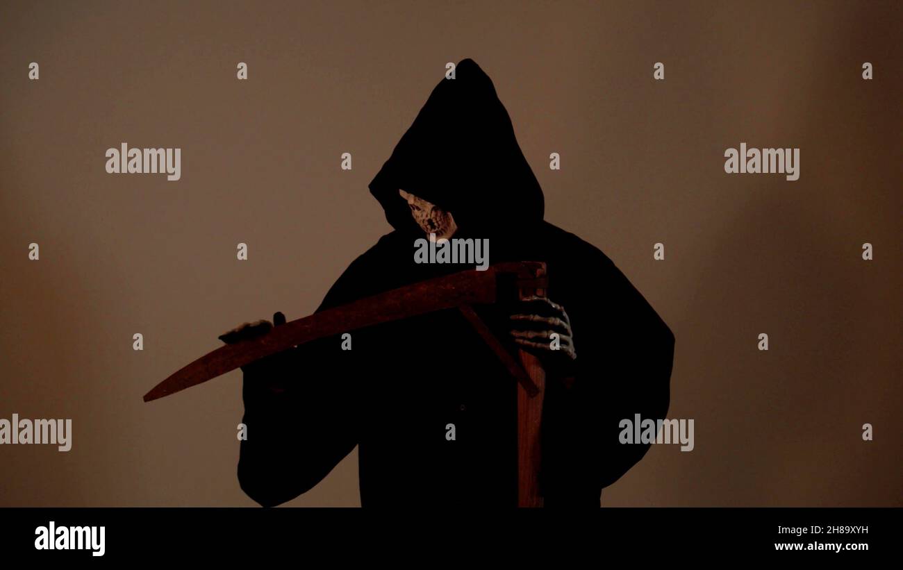 A man in grim reaper Stock Photo - Alamy