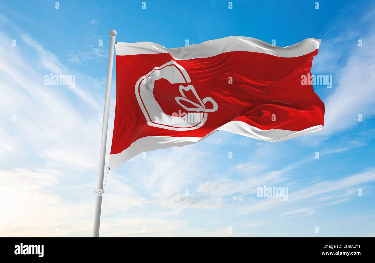 flag of Calgary, Alberta , Canada at cloudy sky background on sunset ...