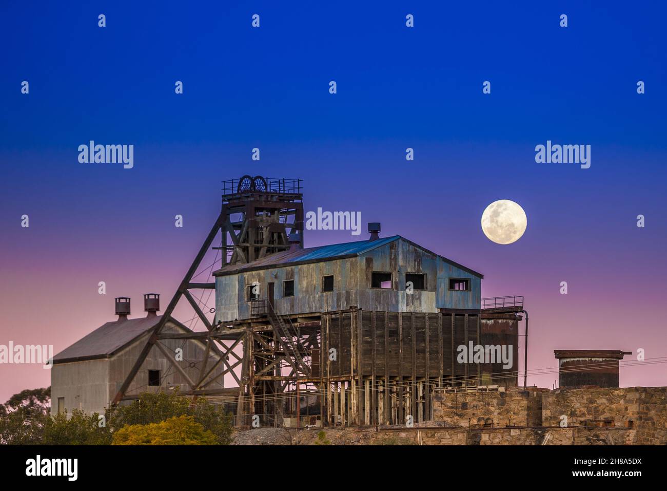 A beautiful view of the industrial buildings and full moon in the clear ...