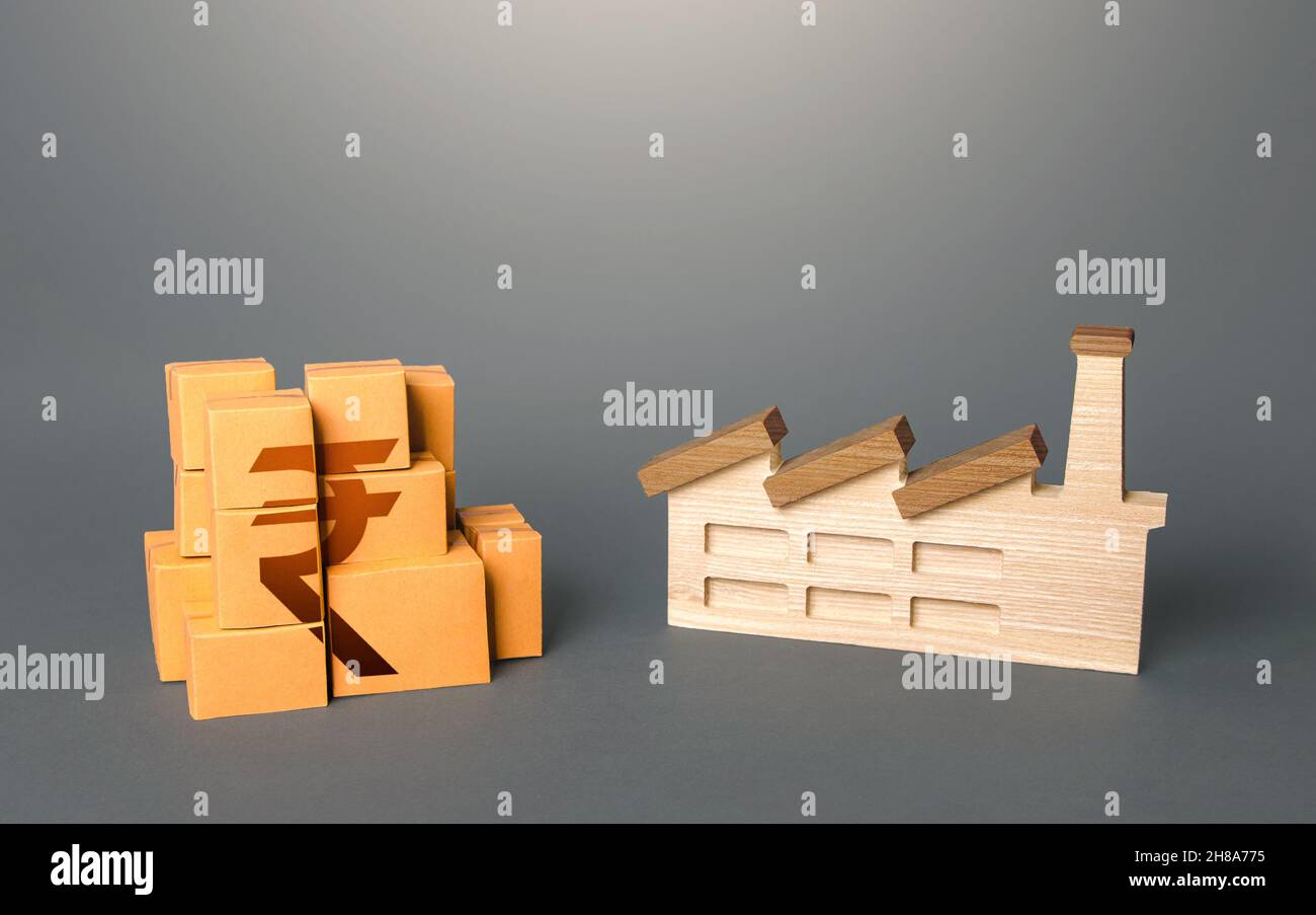 Industrial factory and indian rupee product boxes. Investment in ...