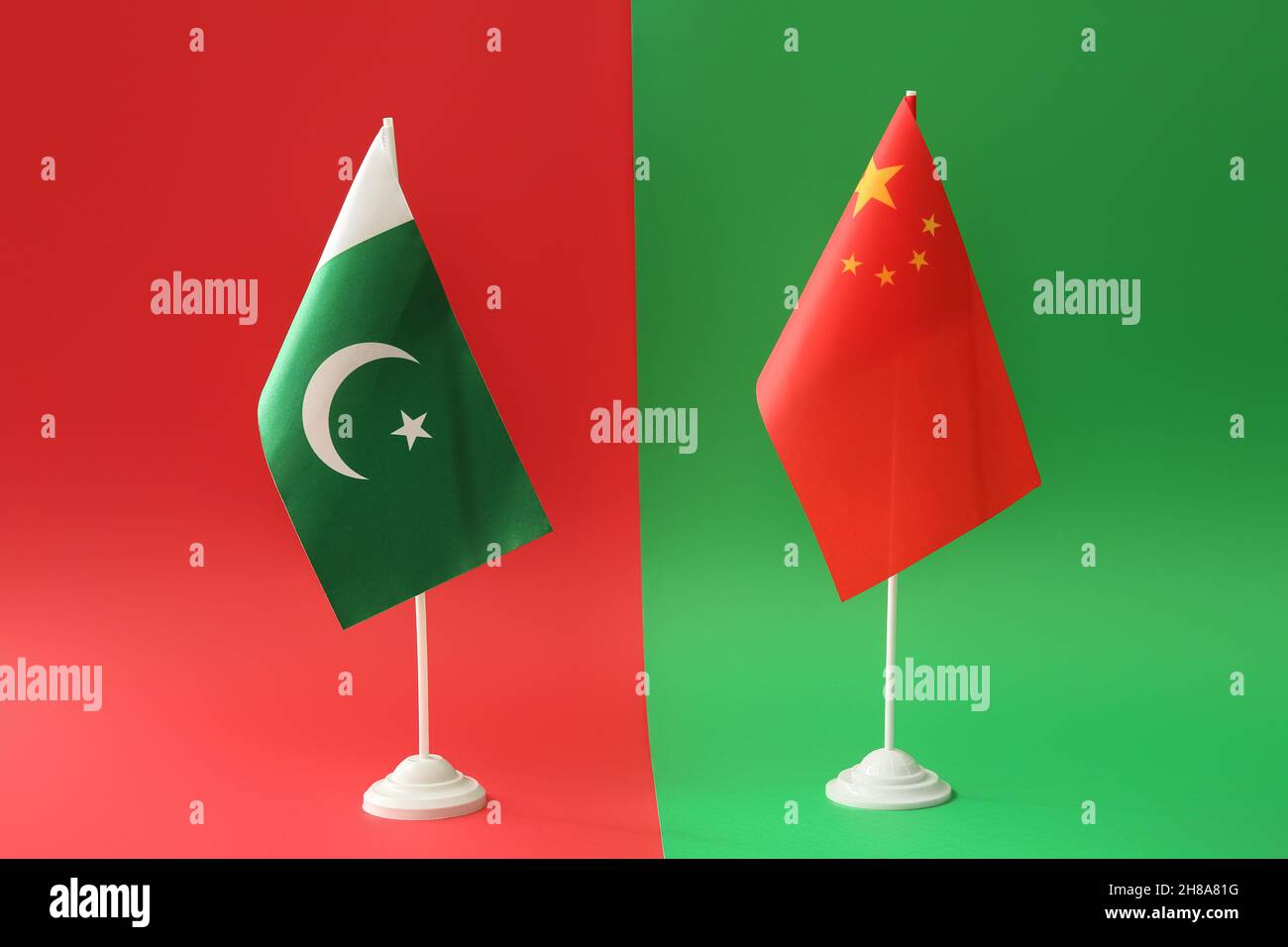 Flags of China and Pakistan on color background Stock Photo - Alamy