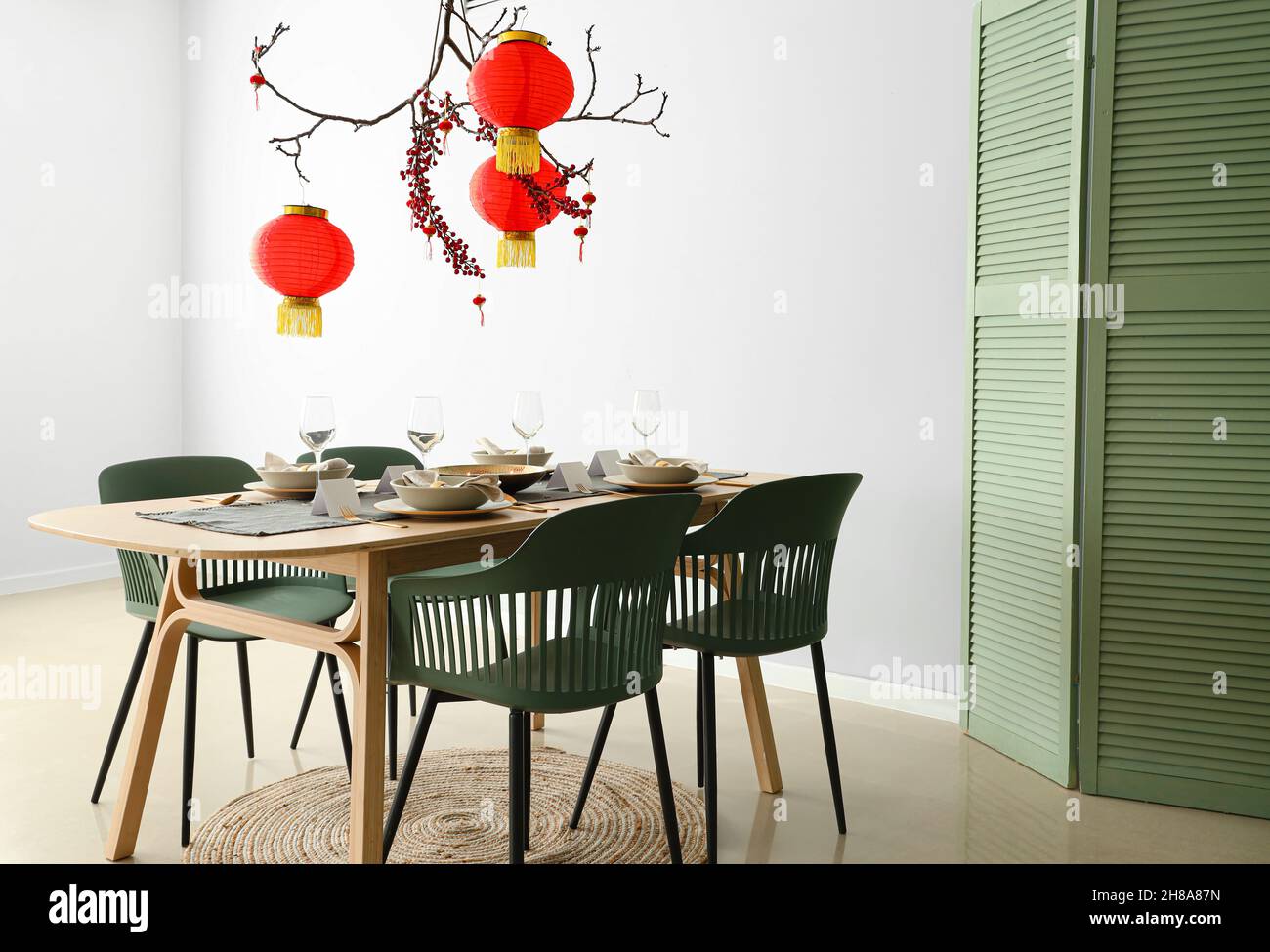 Beautiful table setting for Chinese New Year celebration in room Stock ...
