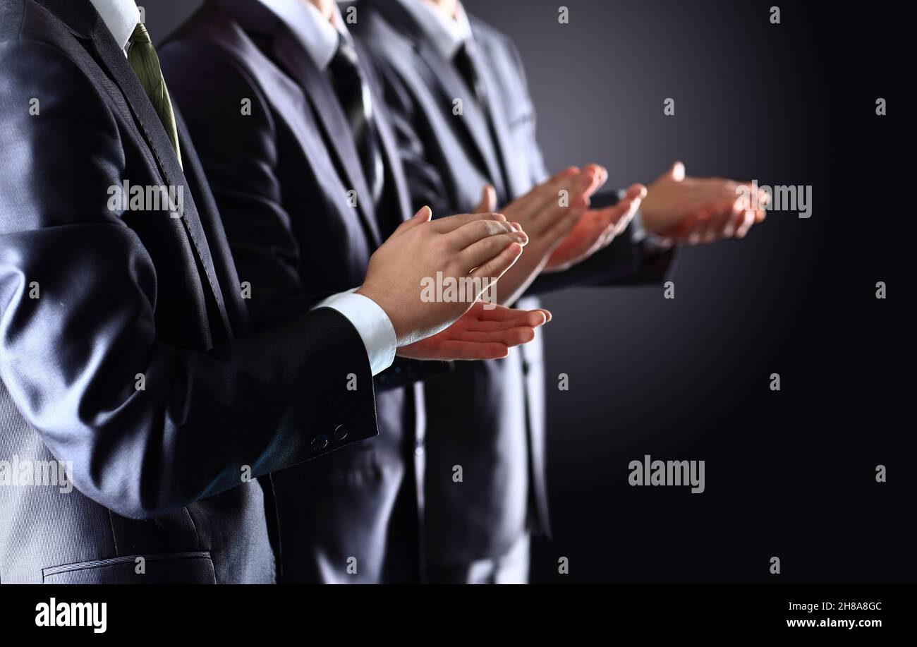 Male hands clapping on black, side-view Stock Photo - Alamy