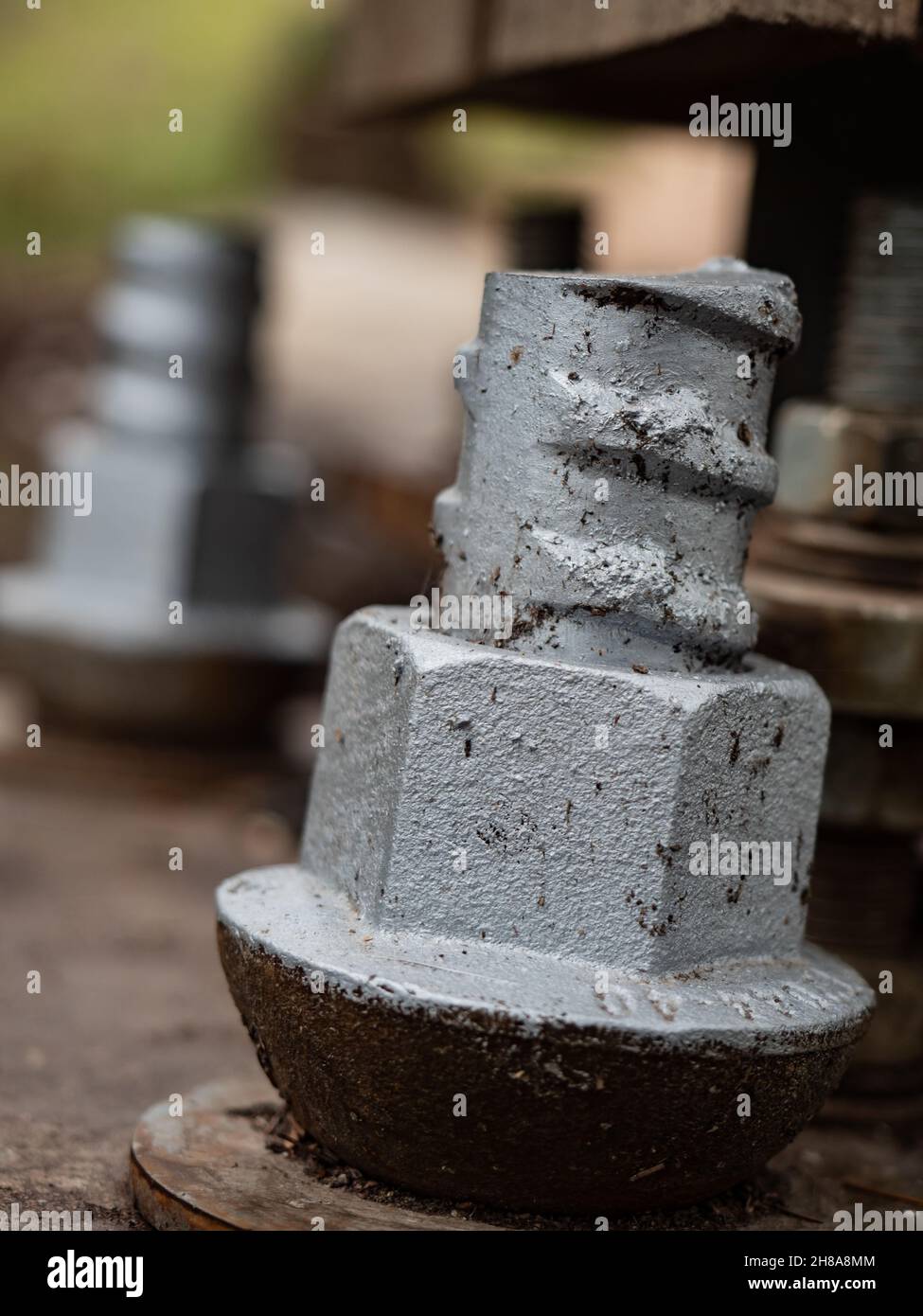Concrete post head nut with painted steel surface. Footpath bridge ...