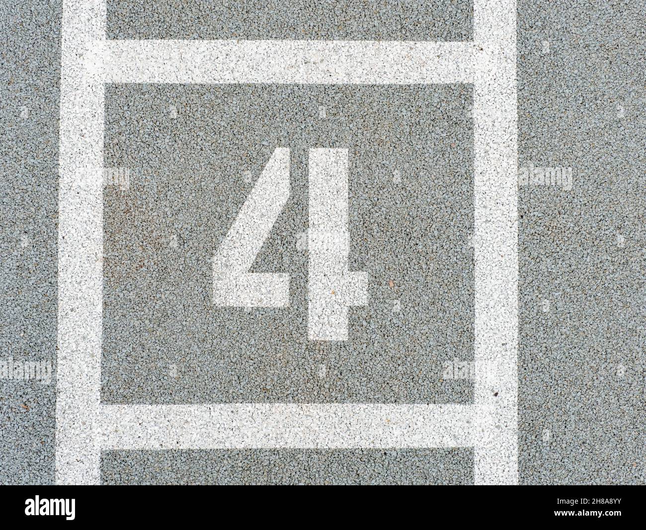 Number four painted on soft rubber surface. Jumping hopscotch game with ...