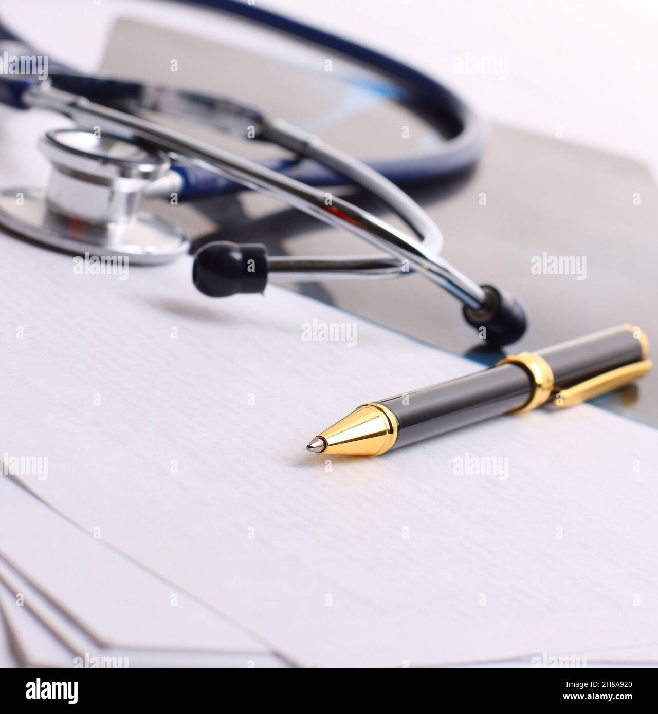 stethoscope with the handle and papers Stock Photo - Alamy