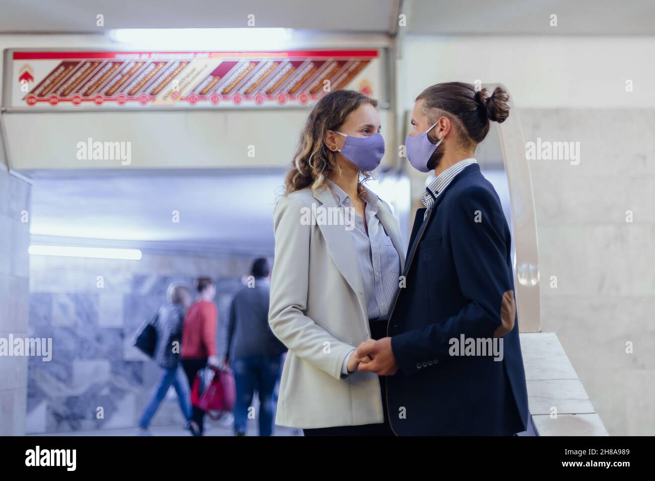 couple in love embraces in the subway crossing. photo with a copy-space ...