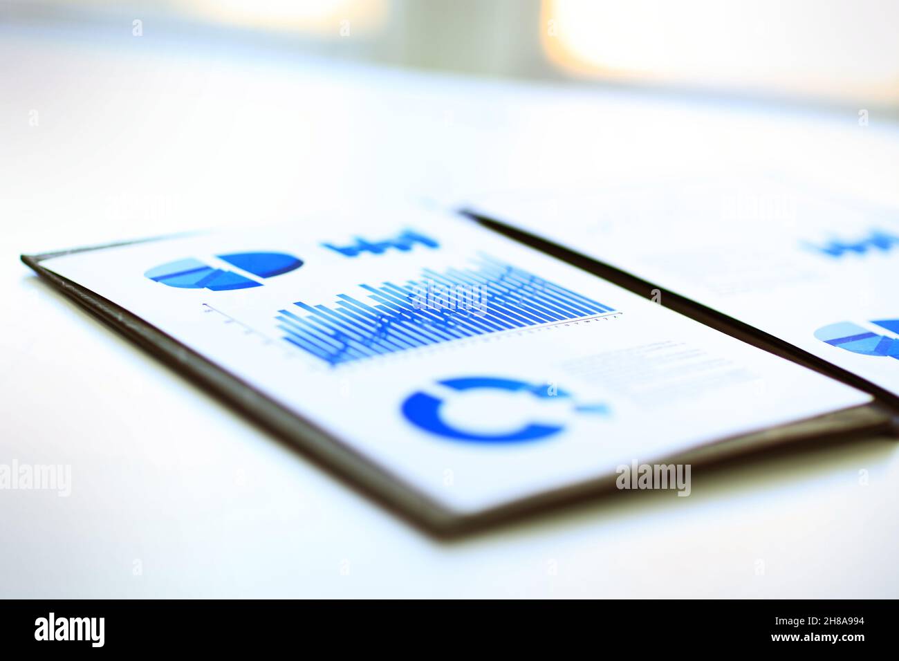 Financial management graphs in a corporate blue color Stock Photo - Alamy