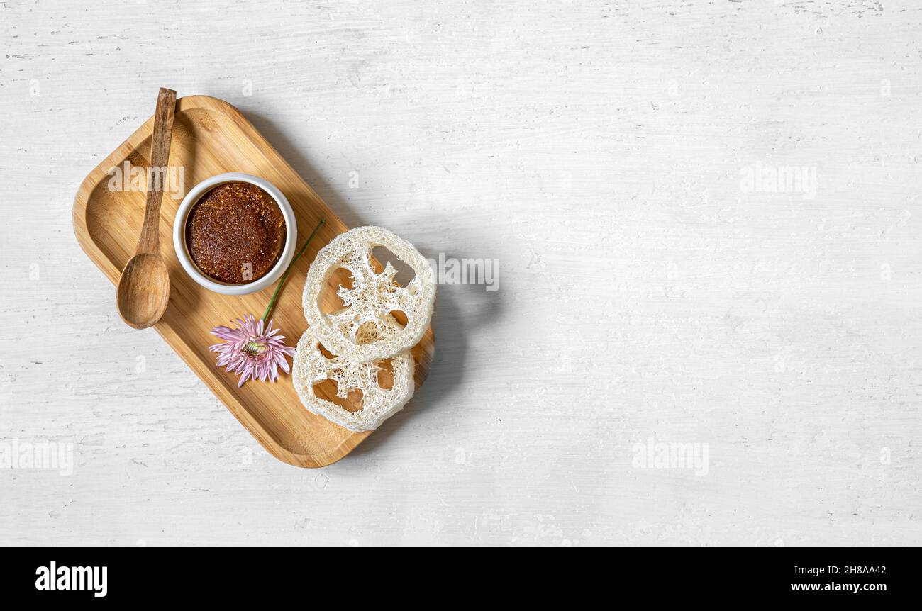Body scrub and other care products on a wooden plate, isolated Stock ...