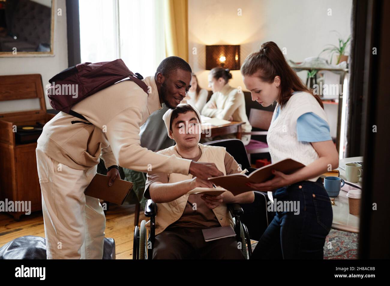 Group of students looking for the book in the library, they showing the ...